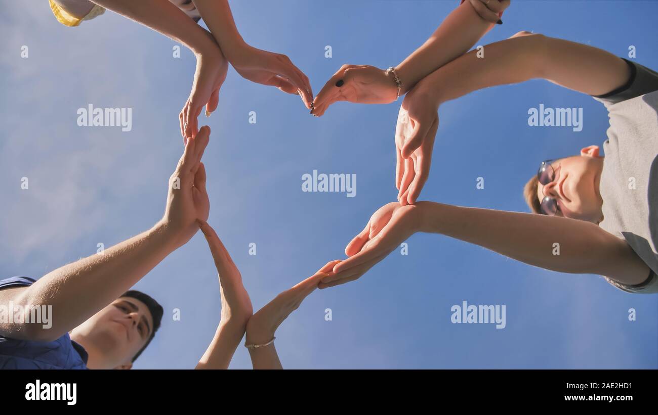 Heart shape hands friends hi-res stock photography and images - Alamy