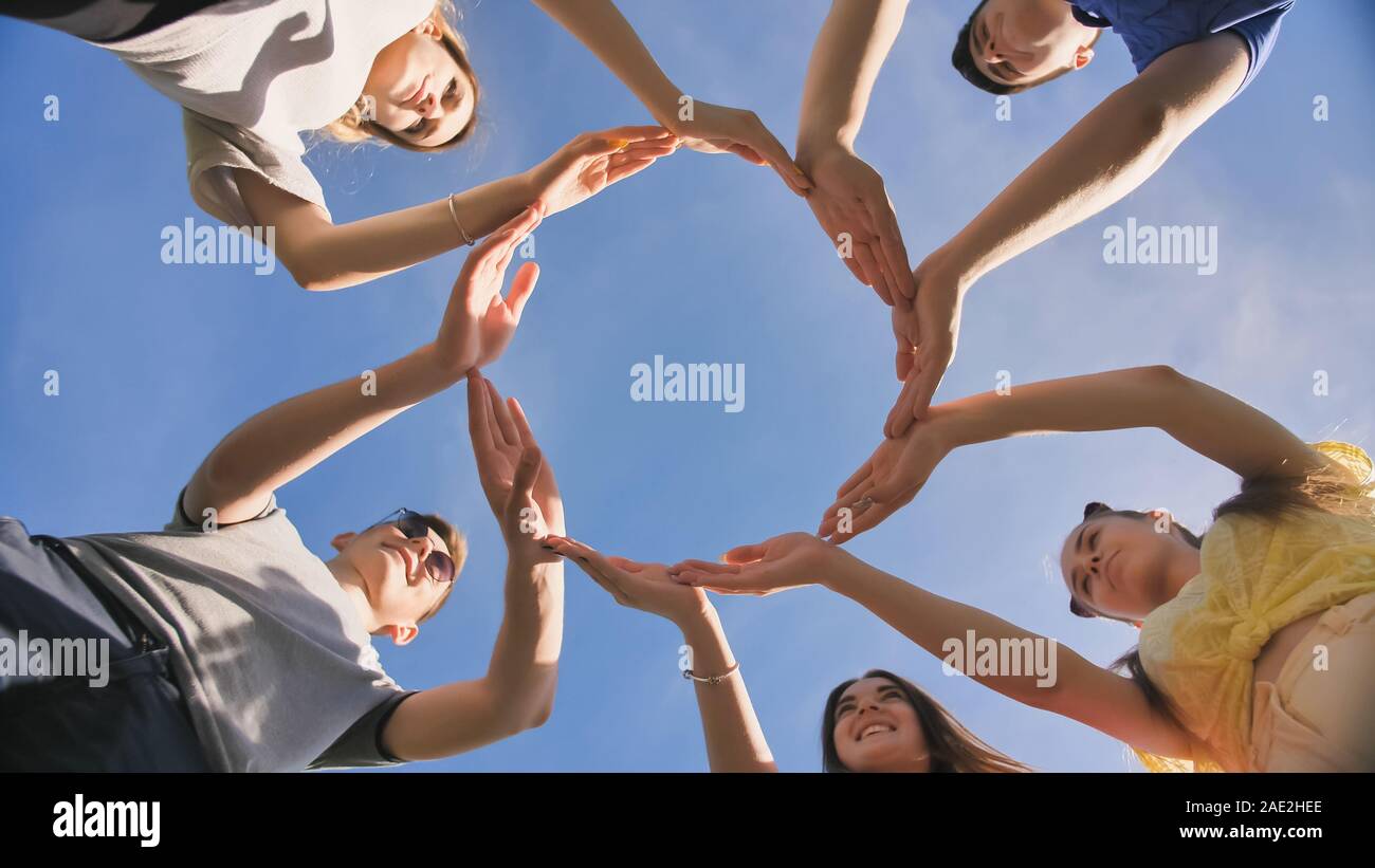 Multiracial hands making a circle hi-res stock photography and images ...