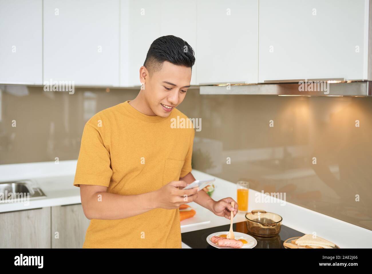 Handsome young man eating cereal hi-res stock photography and images ...