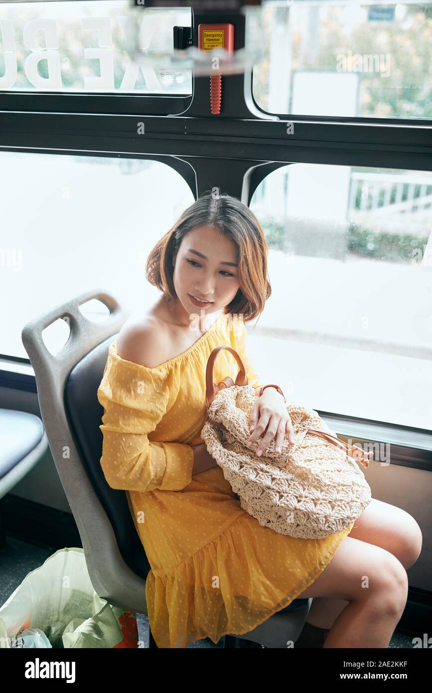 beautiful young woman taking bus to work Stock Photo - Alamy