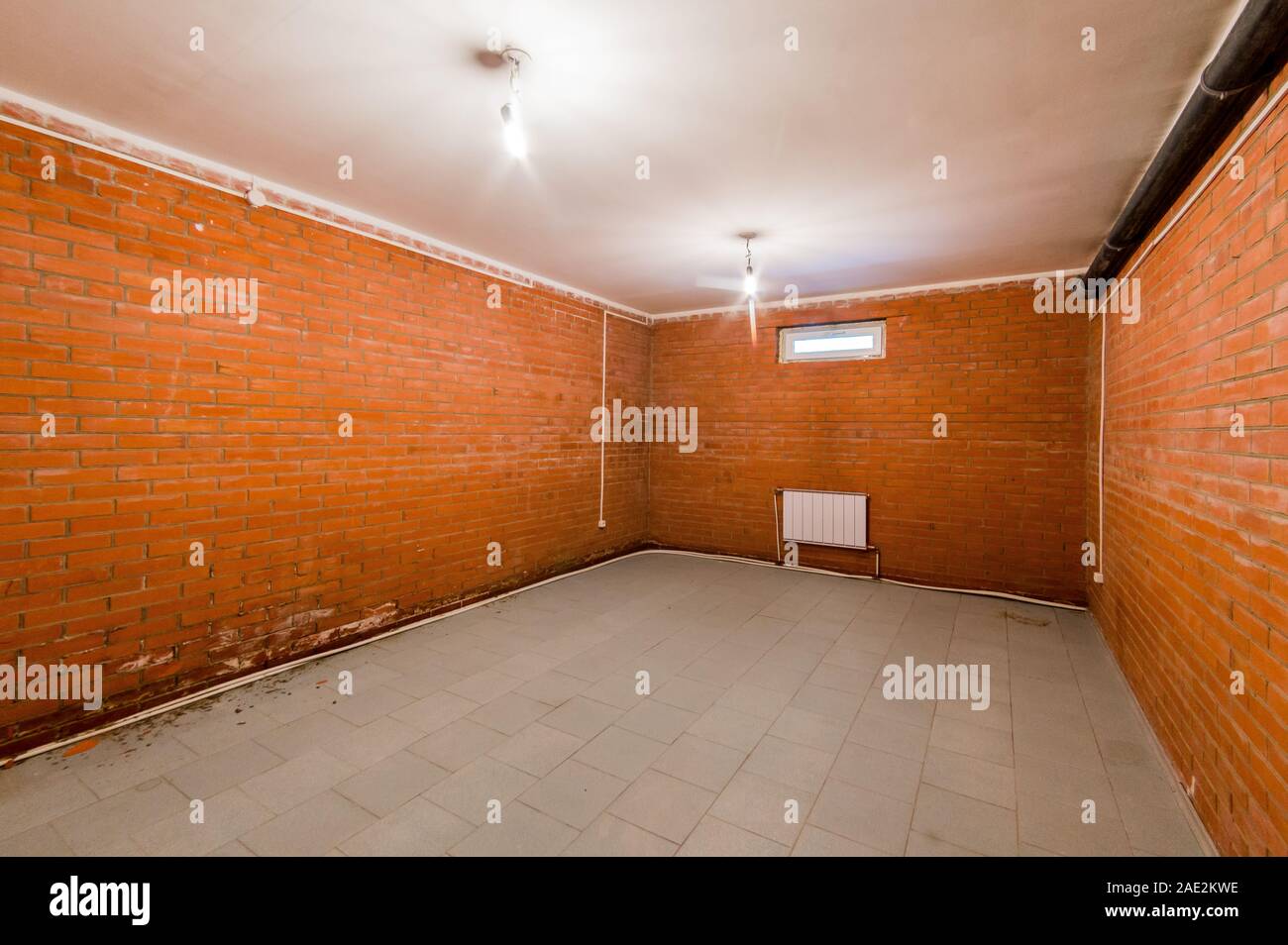 Russia, Omsk- August 02, 2019: interior room empty basement with brick ...
