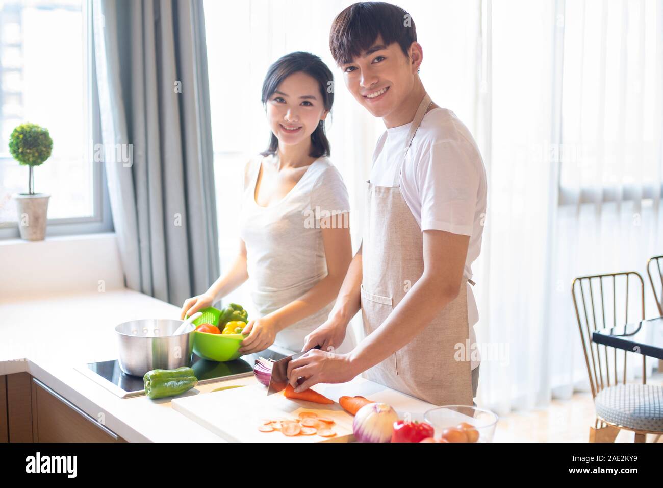 Young couple preparing homemade meal hi-res stock photography and ...