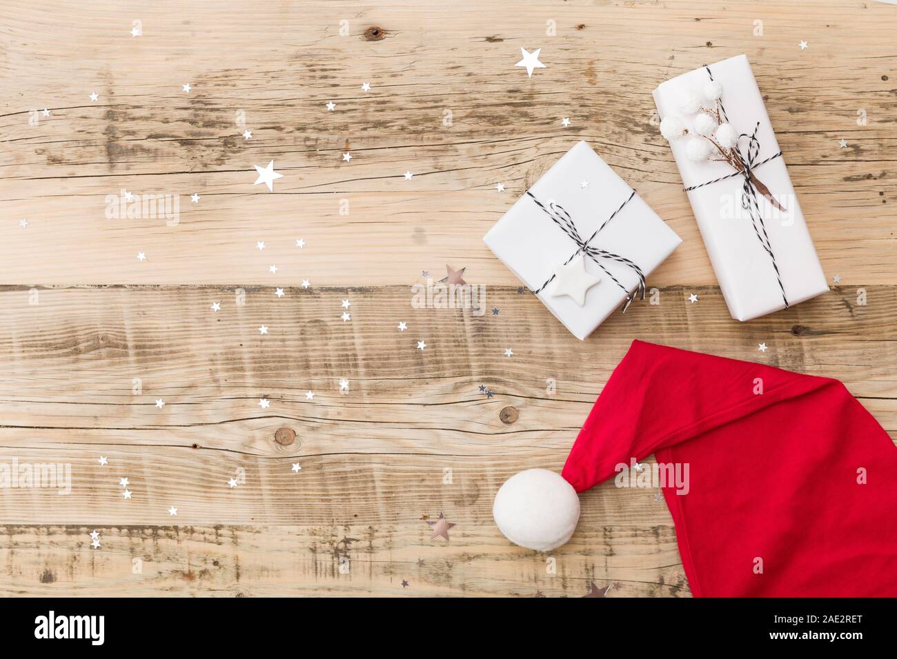 Top view on nice Christmas gifts wrapped in white gift paper, Christmas ...