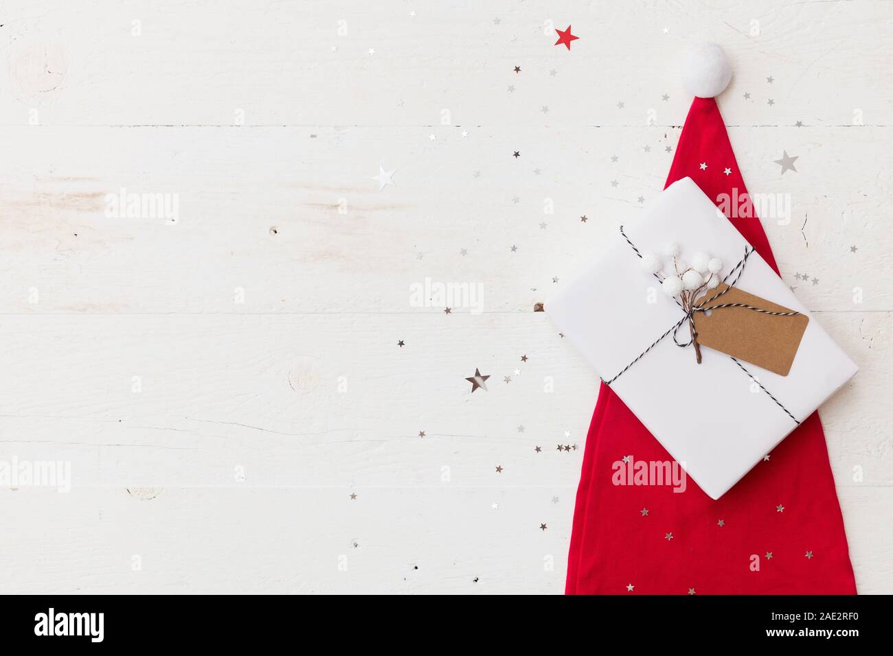 Top view on nice Christmas gift wrapped in white gift paper, Christmas ...