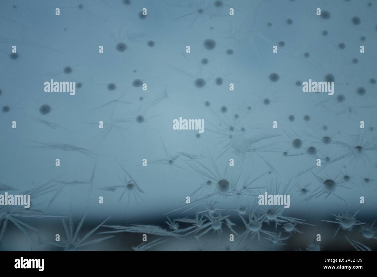 Pattern of frozen ice crystals on window glass conceptual of the ...