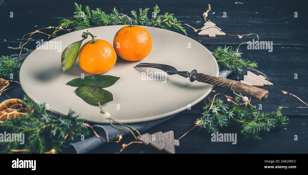 Food banner format. Tangerines on a festive Christmas rustic table ...