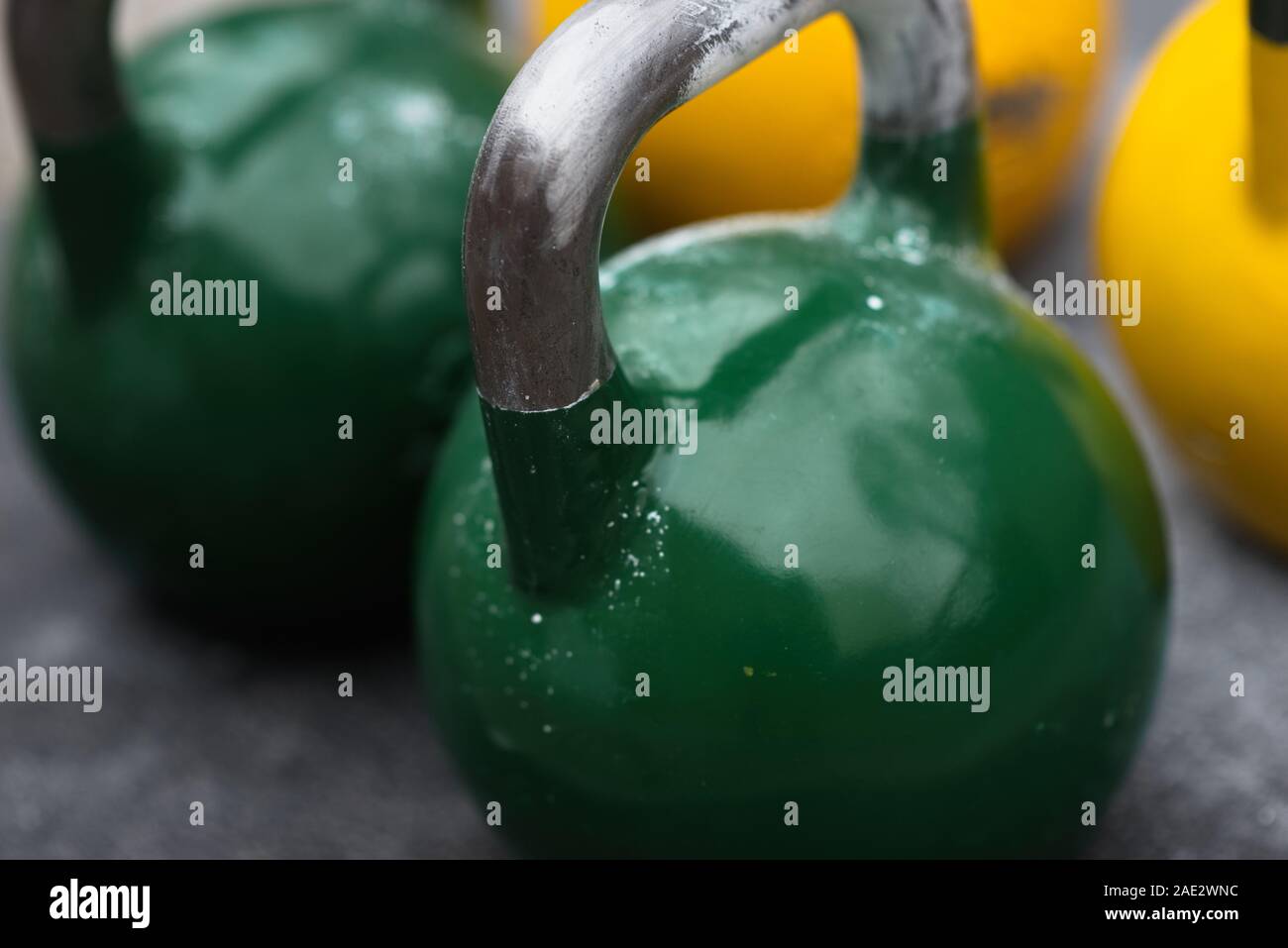 Old used kettlebell outside on the floor ready for strength and ...