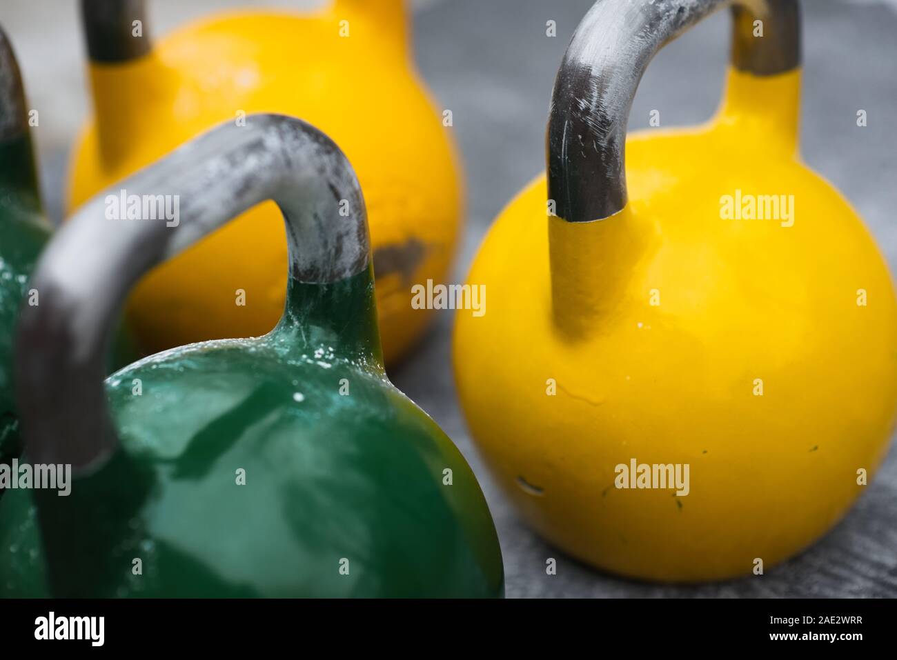 Old used kettlebell outside on the floor ready for strength and ...