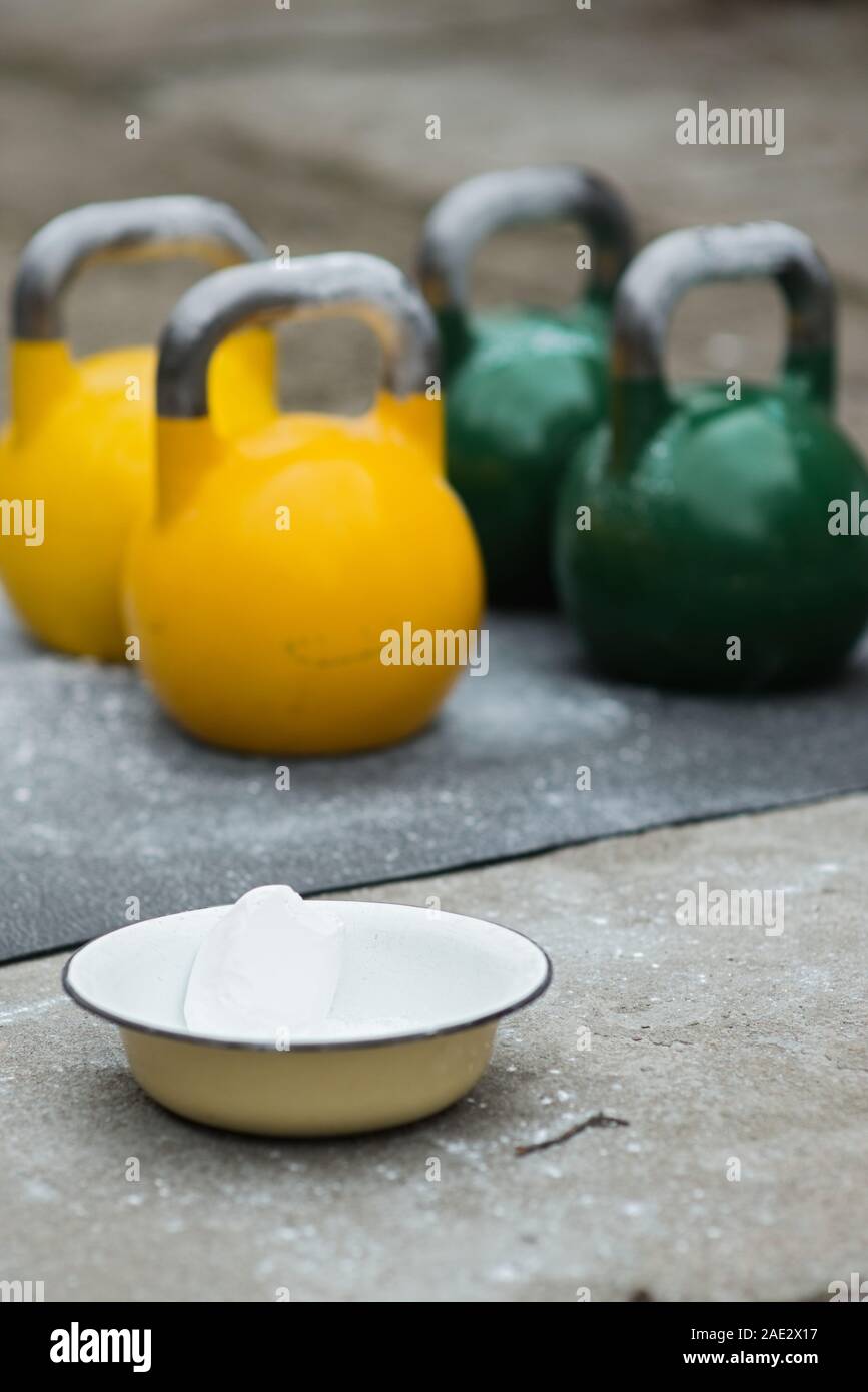 Old used kettlebell outside on the floor ready for strength and ...