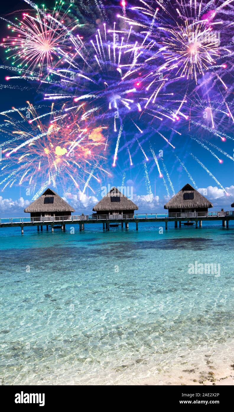 Festive New Year's fireworks over the tropical island, mixed media ...