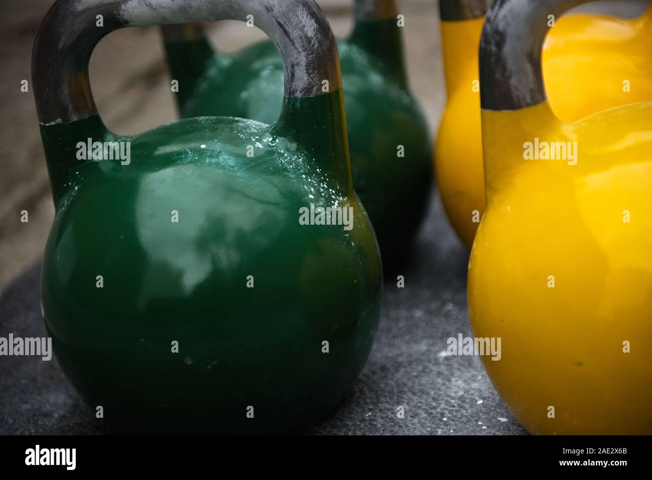 Old used kettlebell outside on the floor ready for strength and ...