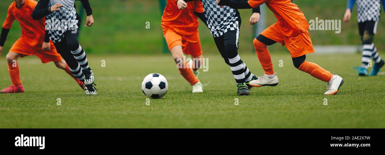 Horizontal Image of Soccer Players Running After Ball and Playing a ...