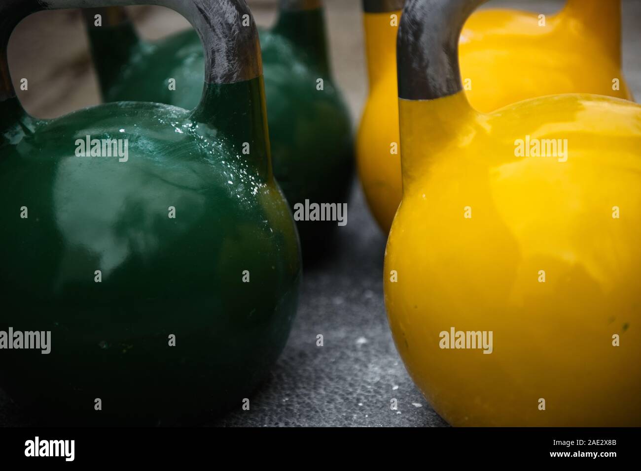 Old used kettlebell outside on the floor ready for strength and ...