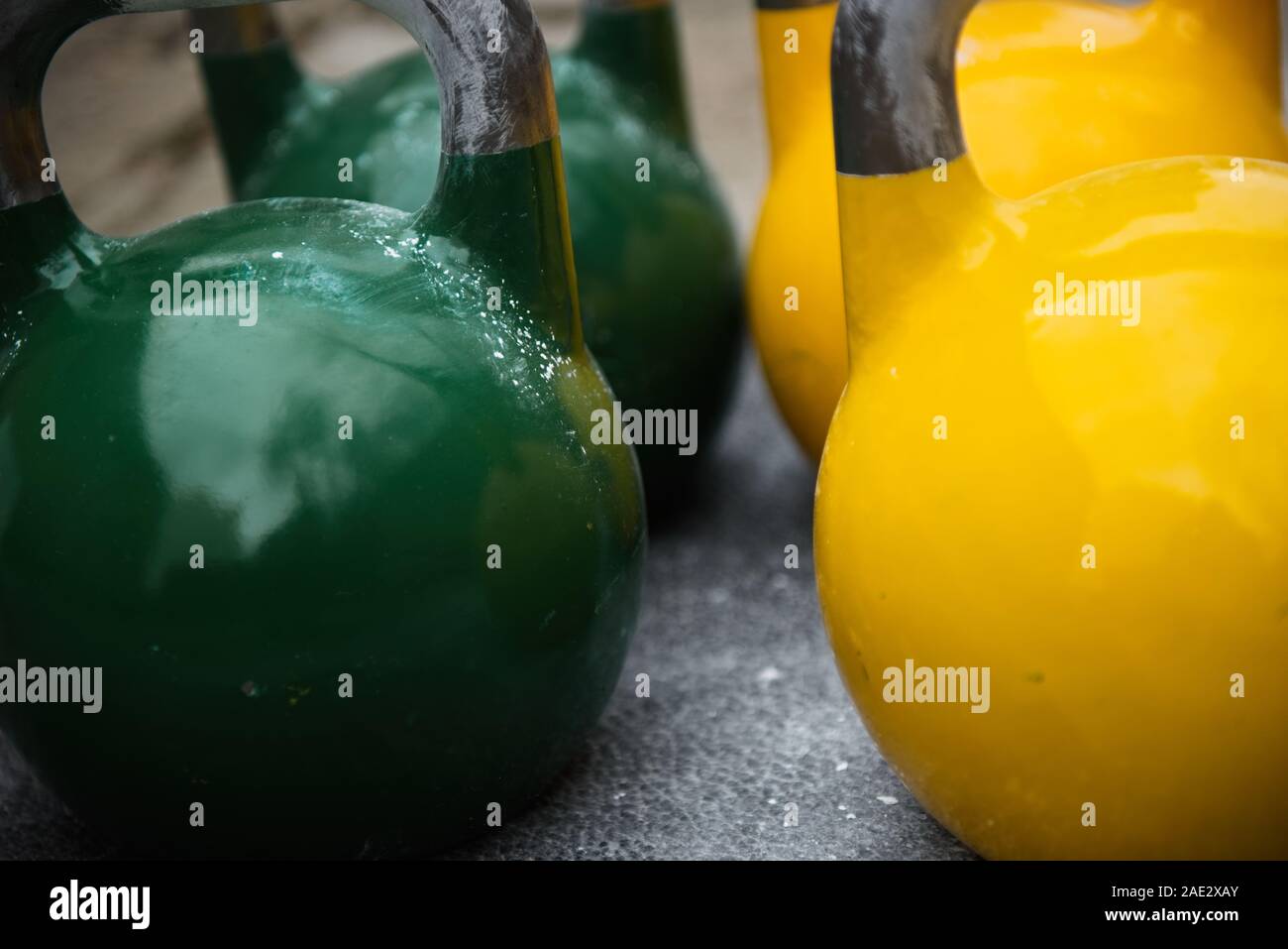 Old used kettlebell outside on the floor ready for strength and ...