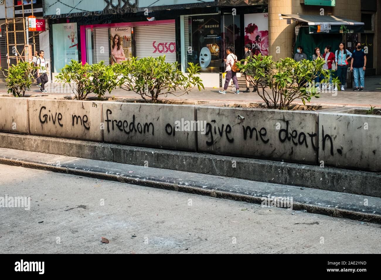 HongKong - November, 2019: Graffiti reads "Give me freedom or give me ...