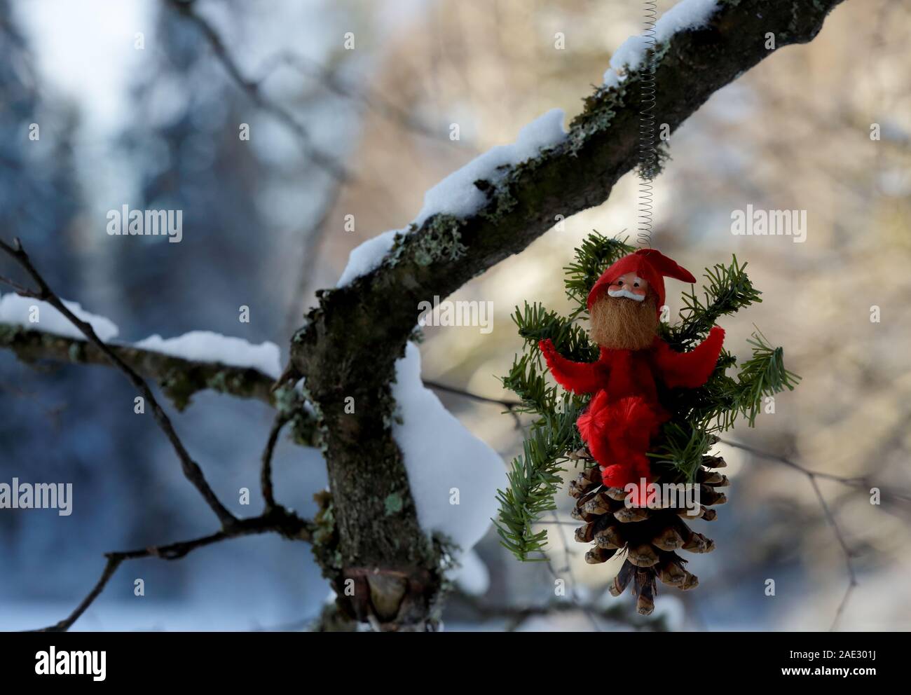 An old vintage Christmas elf made of pipe cleaner hanging with his ...