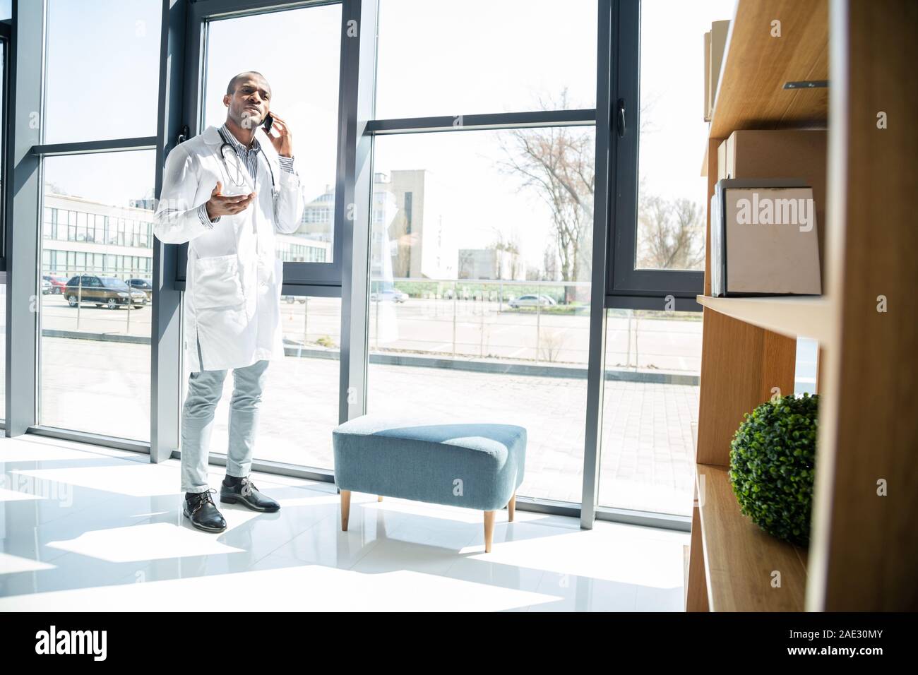 Emotional doctor actively gesticulating while talking Stock Photo - Alamy