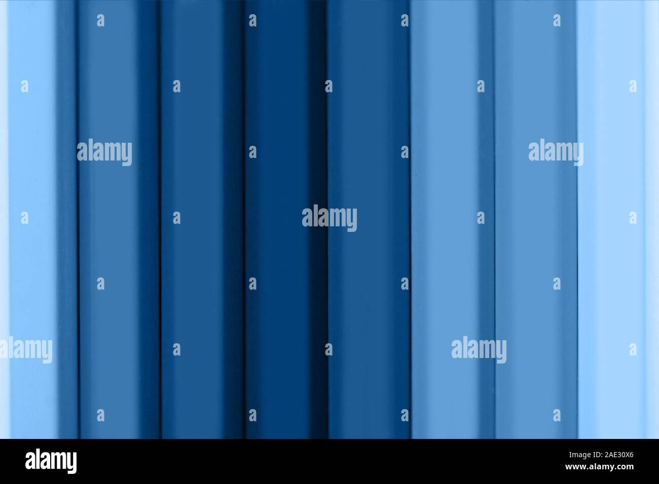 Close-up of pencils in blue colors. Gradient background. The concept of ...