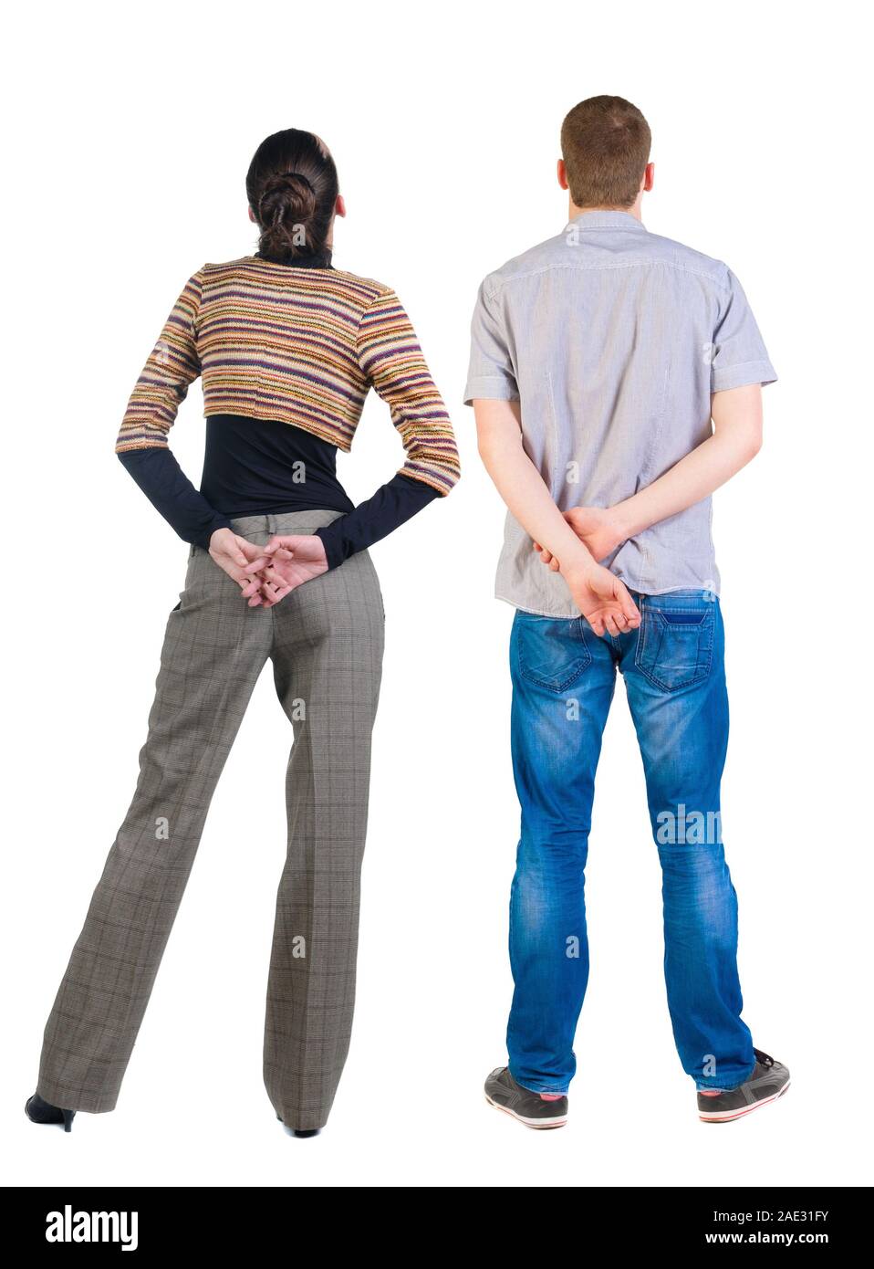 Back view of couple. beautiful friendly girl and guy together. Rear ...