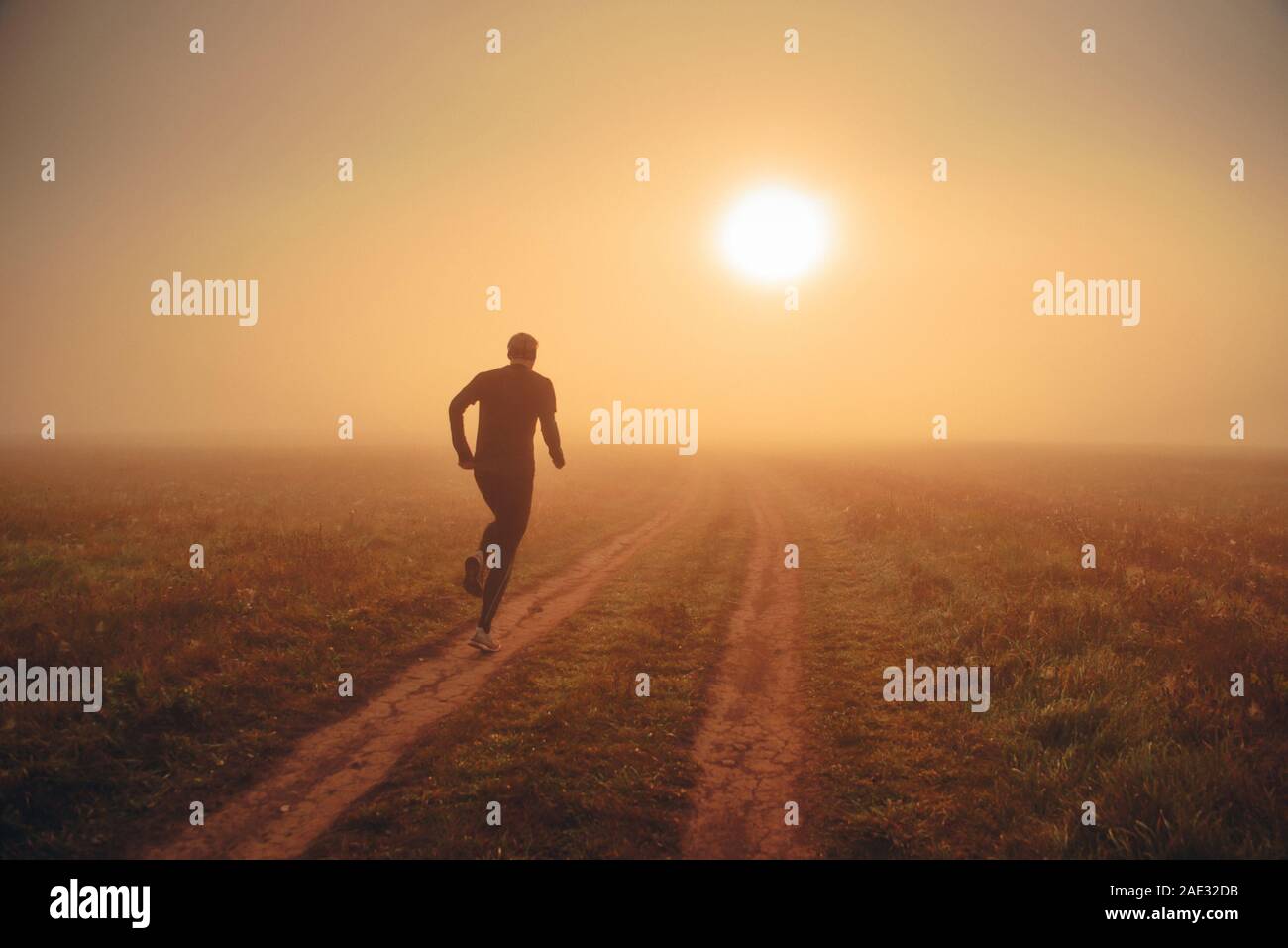 Health and fitness concept photo. Alone runner train in orange autumn ...