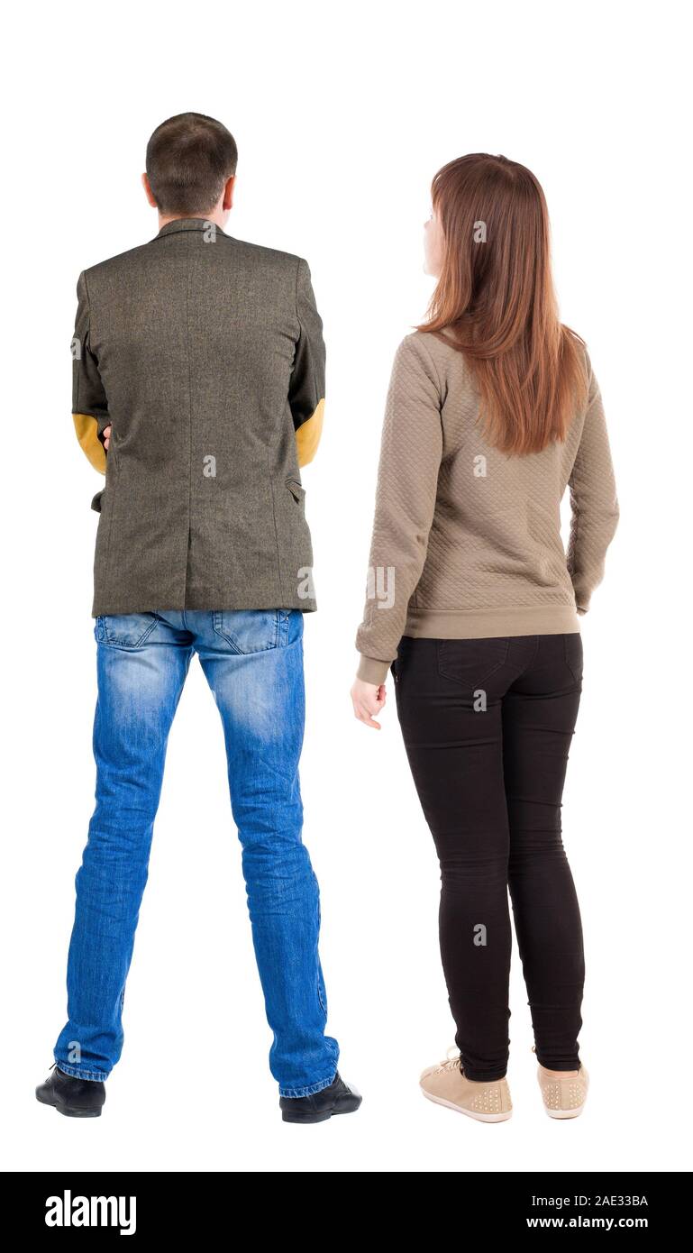 Back view of couple. beautiful friendly girl and guy together. Rear ...