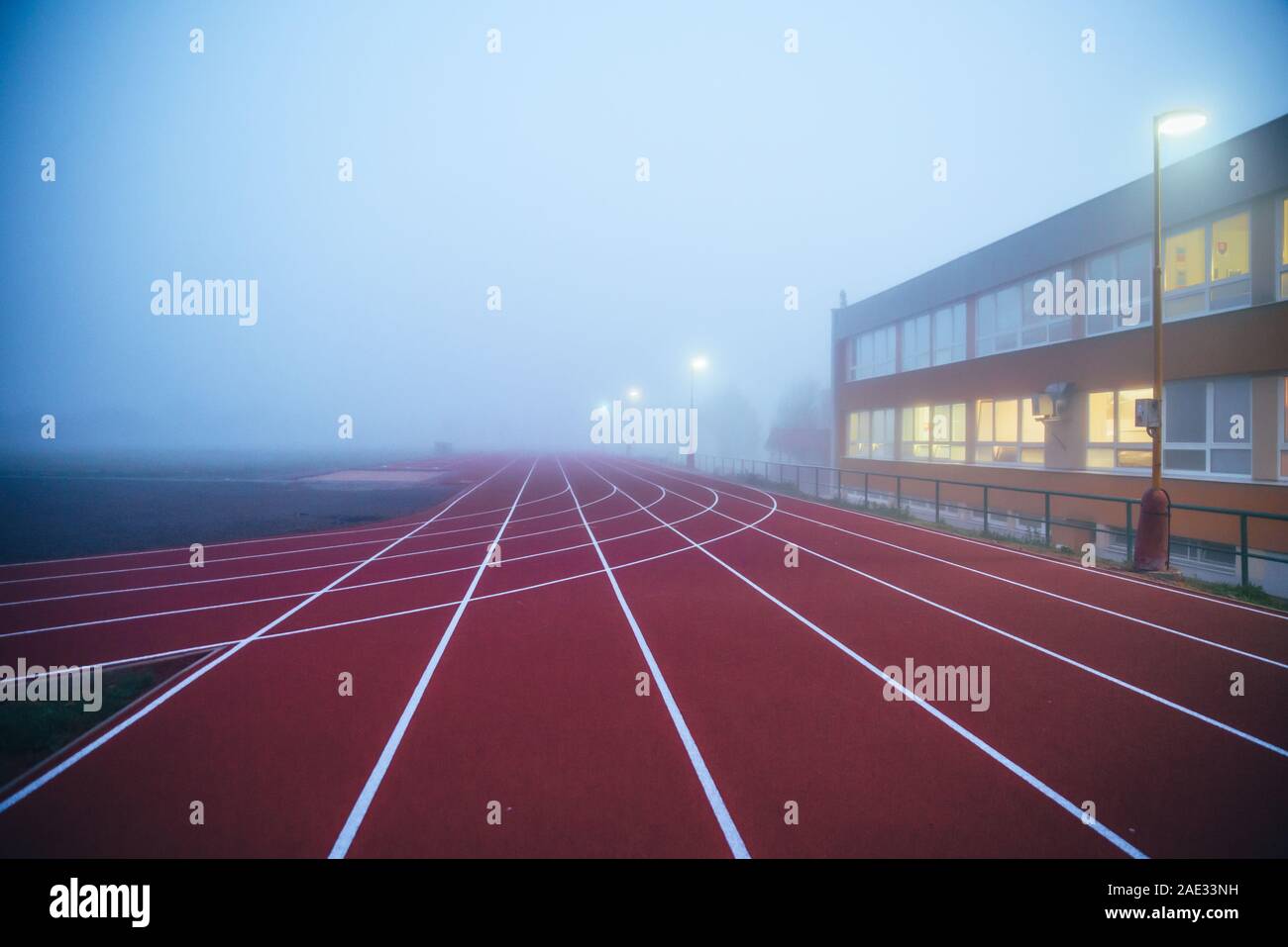 Athletics red Track in morning mist. Sport photo Stock Photo - Alamy