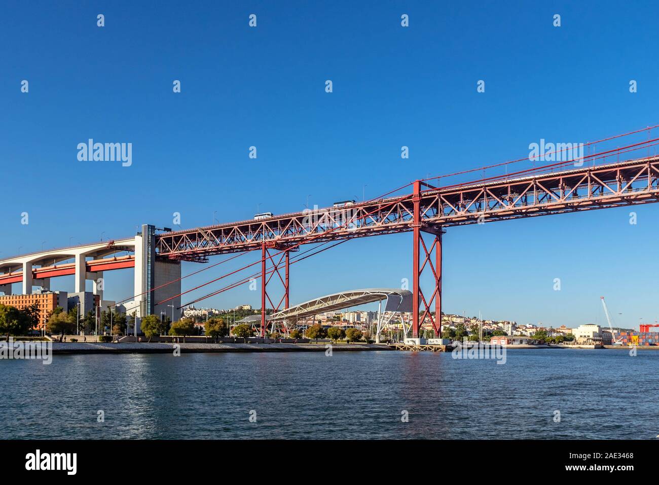 Two buses crossing 25th of April Bridge Stock Photo - Alamy