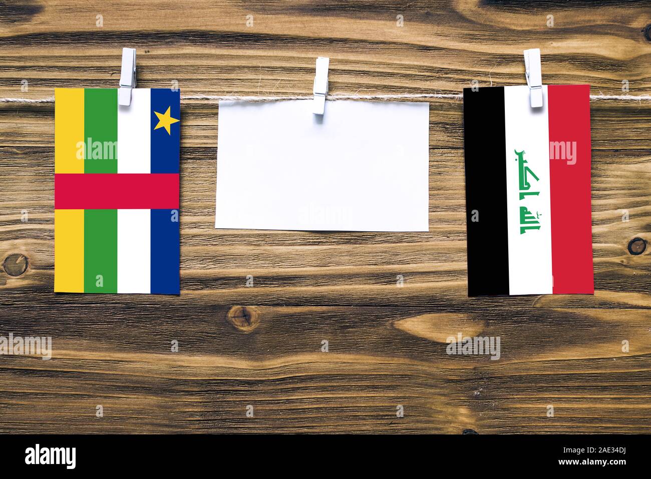 Hanging flags of Central African Republic and Iraq attached to rope ...