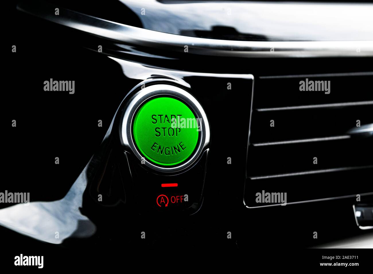 Car dashboard with focus on engine start stop button. Modern car ...