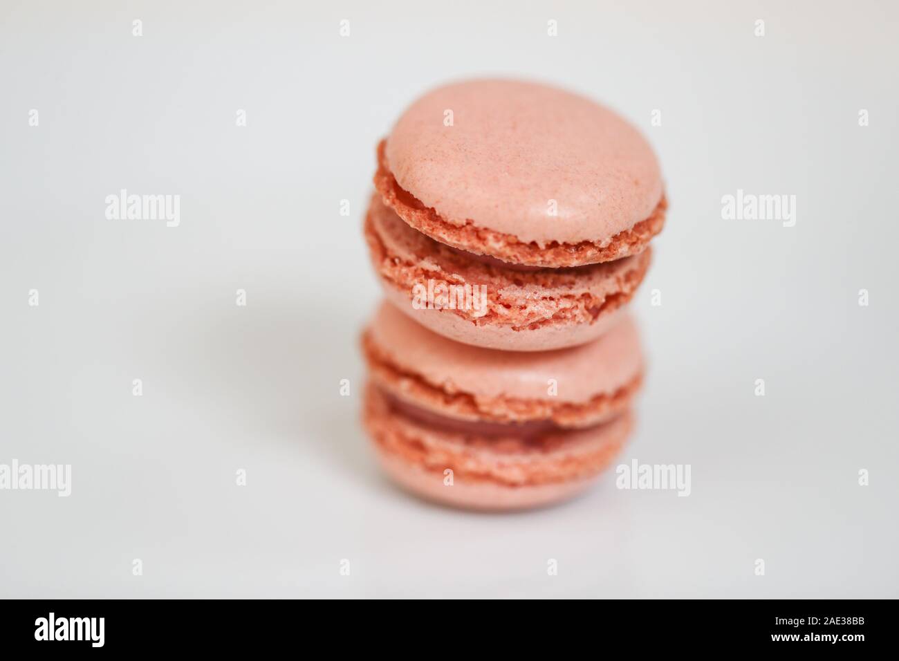 Delicious macaron sweets arranged in rows, colorful macaroon dessert on white background. -Image ...