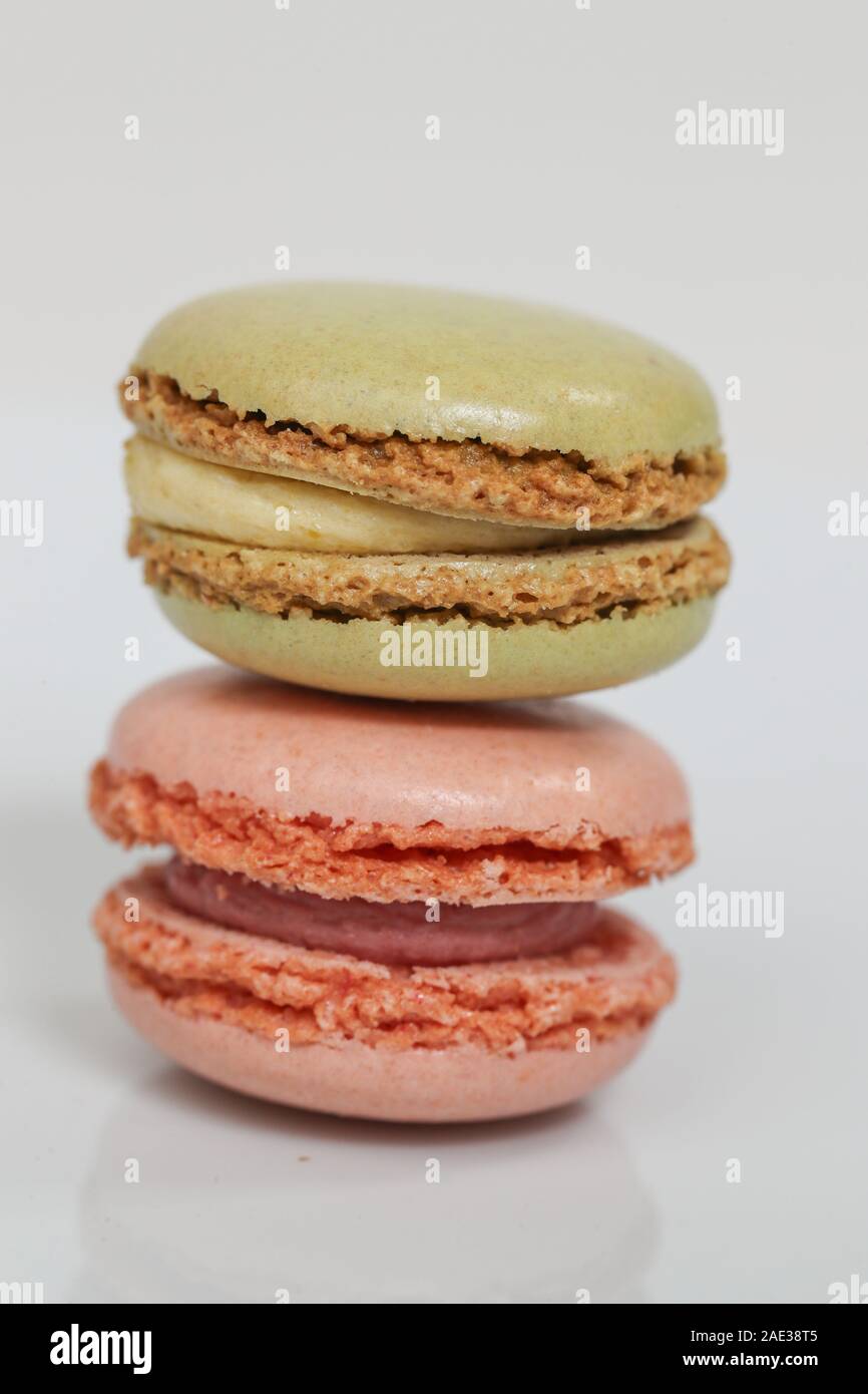 Delicious macaron sweets arranged in rows, colorful macaroon dessert on white background. -Image ...