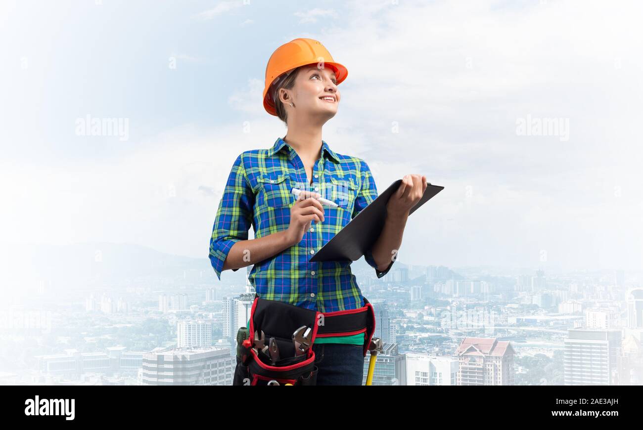 Young building inspector checking outdoor Stock Photo - Alamy