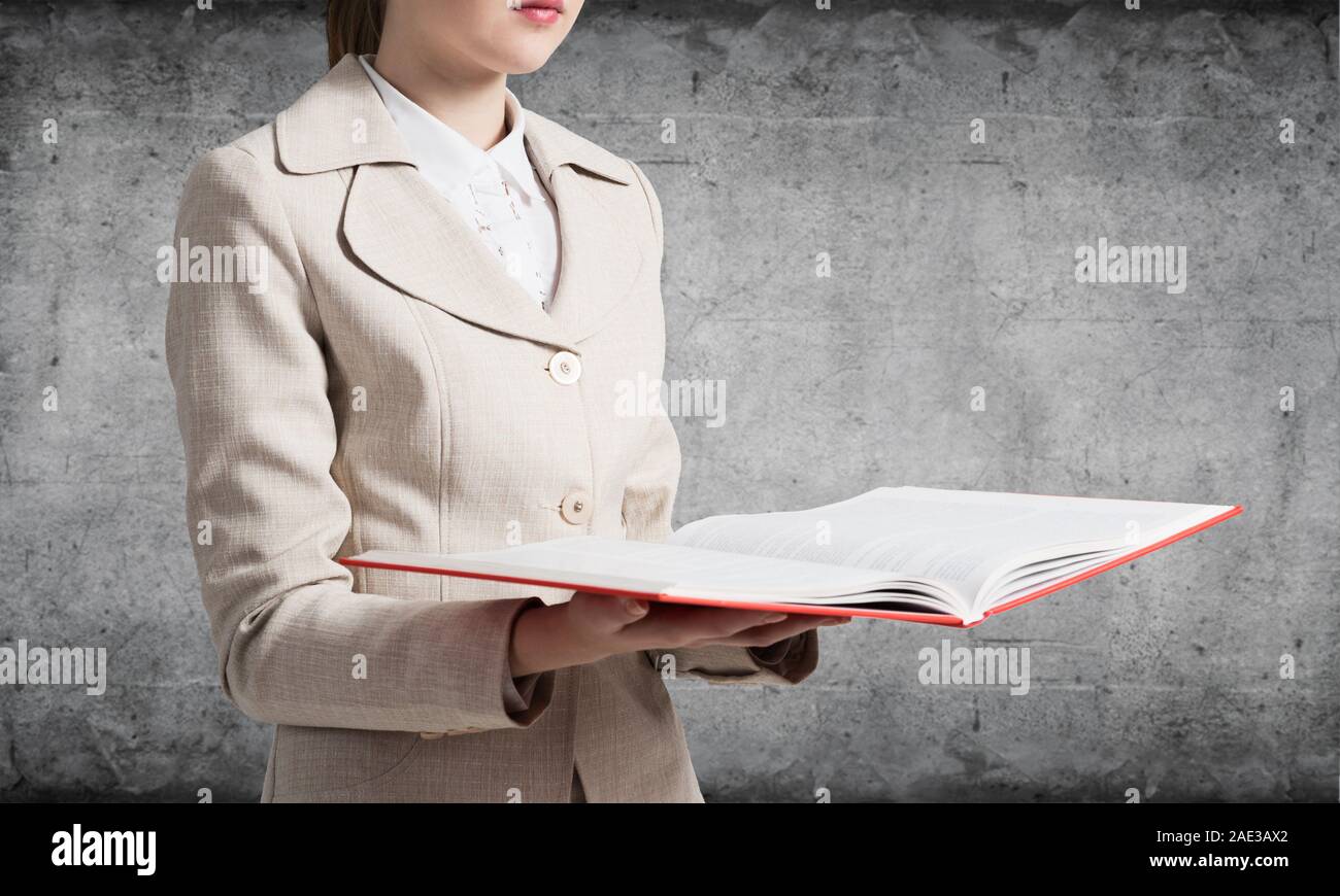 Corporate employee holding open notebook Stock Photo - Alamy
