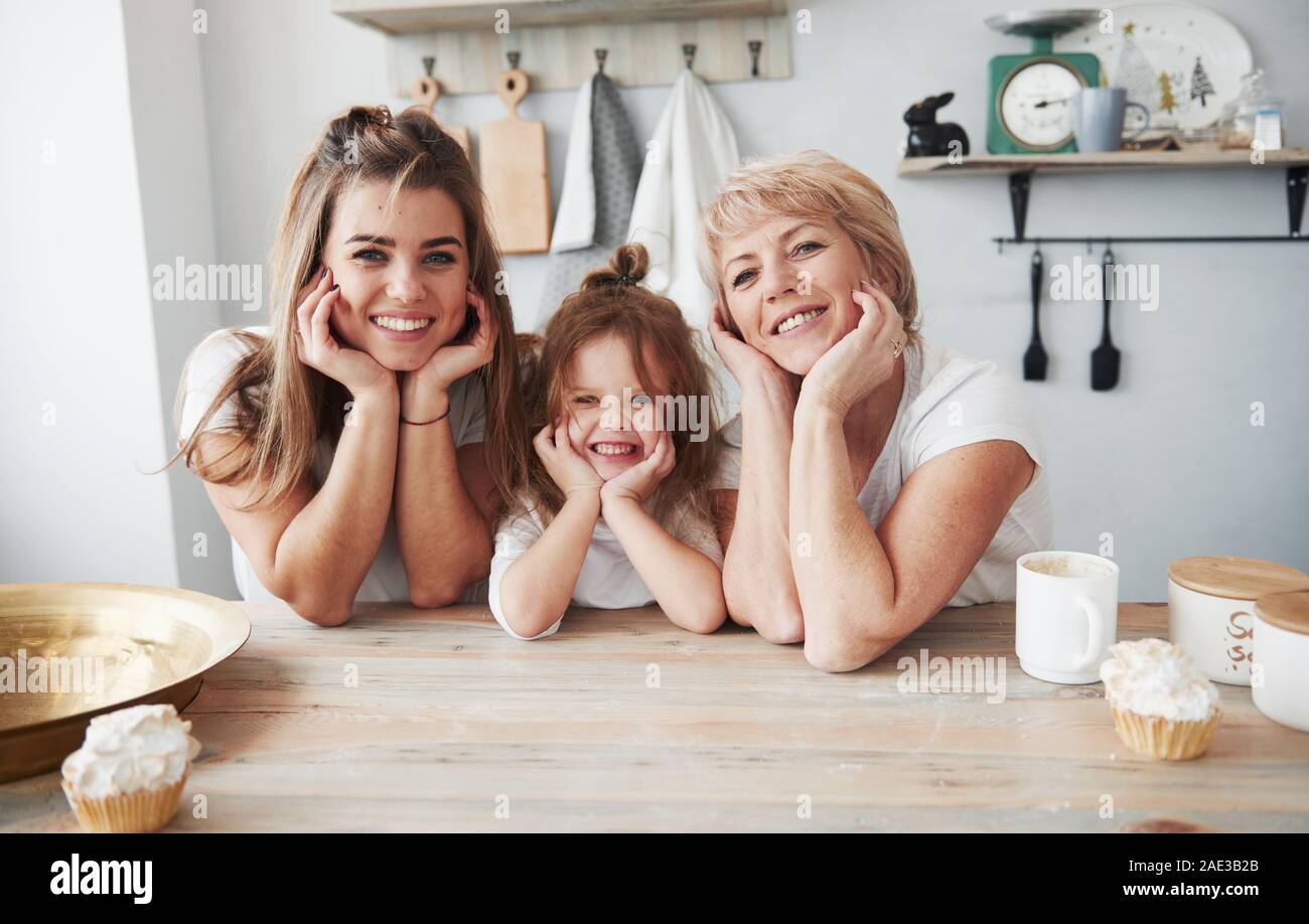 Nice portrait. Mother, grandmother and daughter having good time in the ...