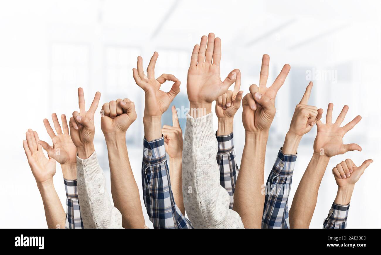 Row raised hands showing different hi-res stock photography and images ...