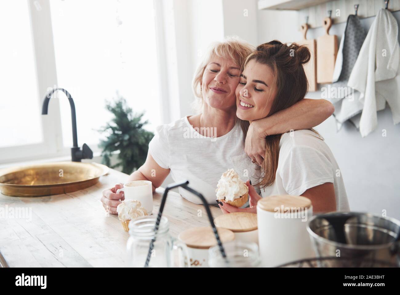 Loving parent. Mother and daughter having good time in the kitchen ...