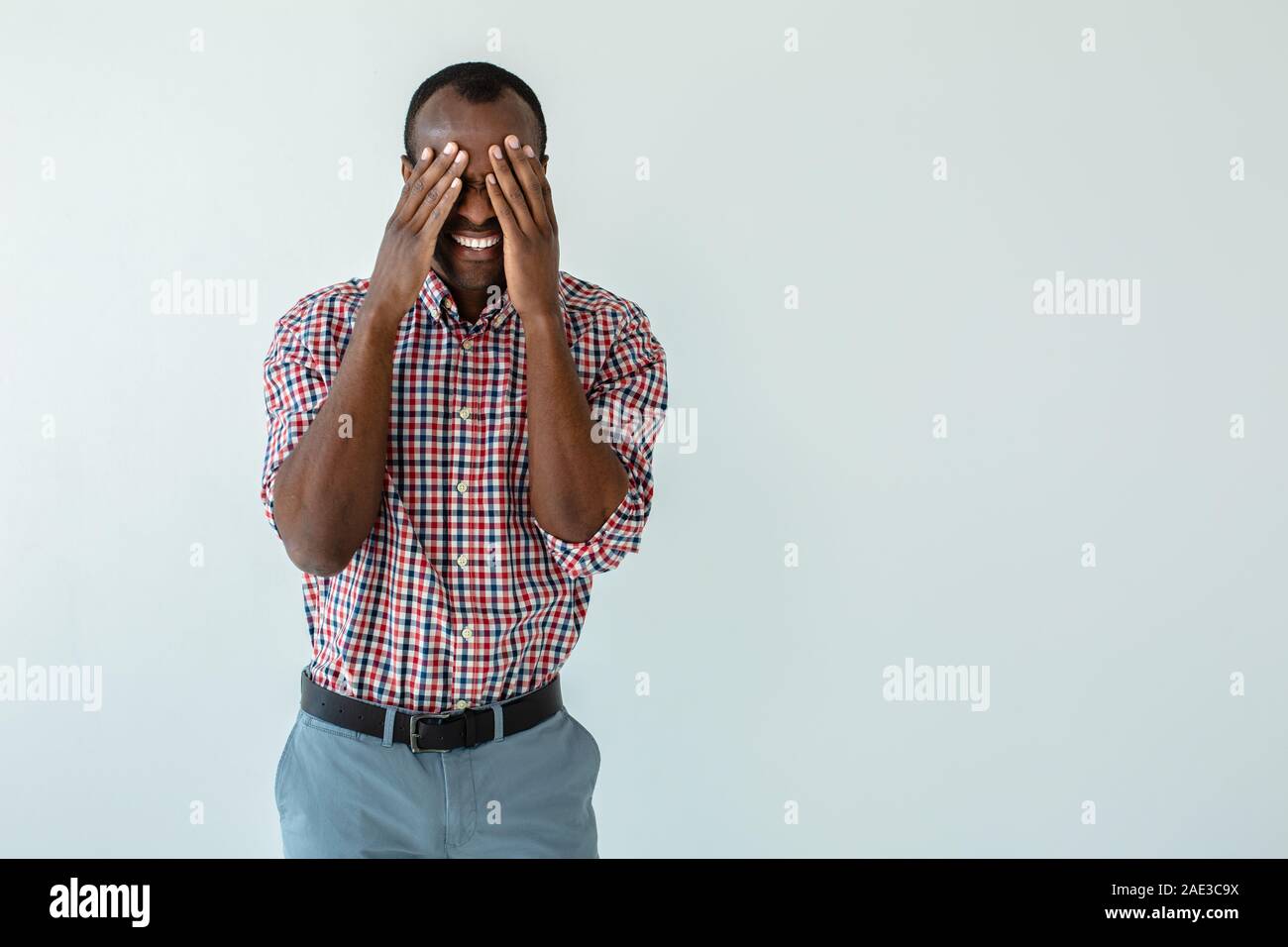 Overjoyed smiling man feeling happy against white background Stock ...