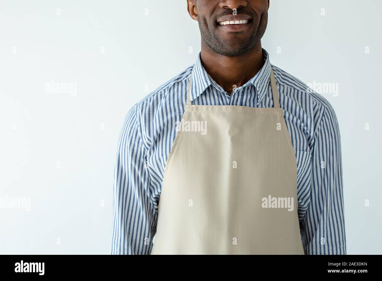 Joyful afro american waiter smiling Stock Photo - Alamy