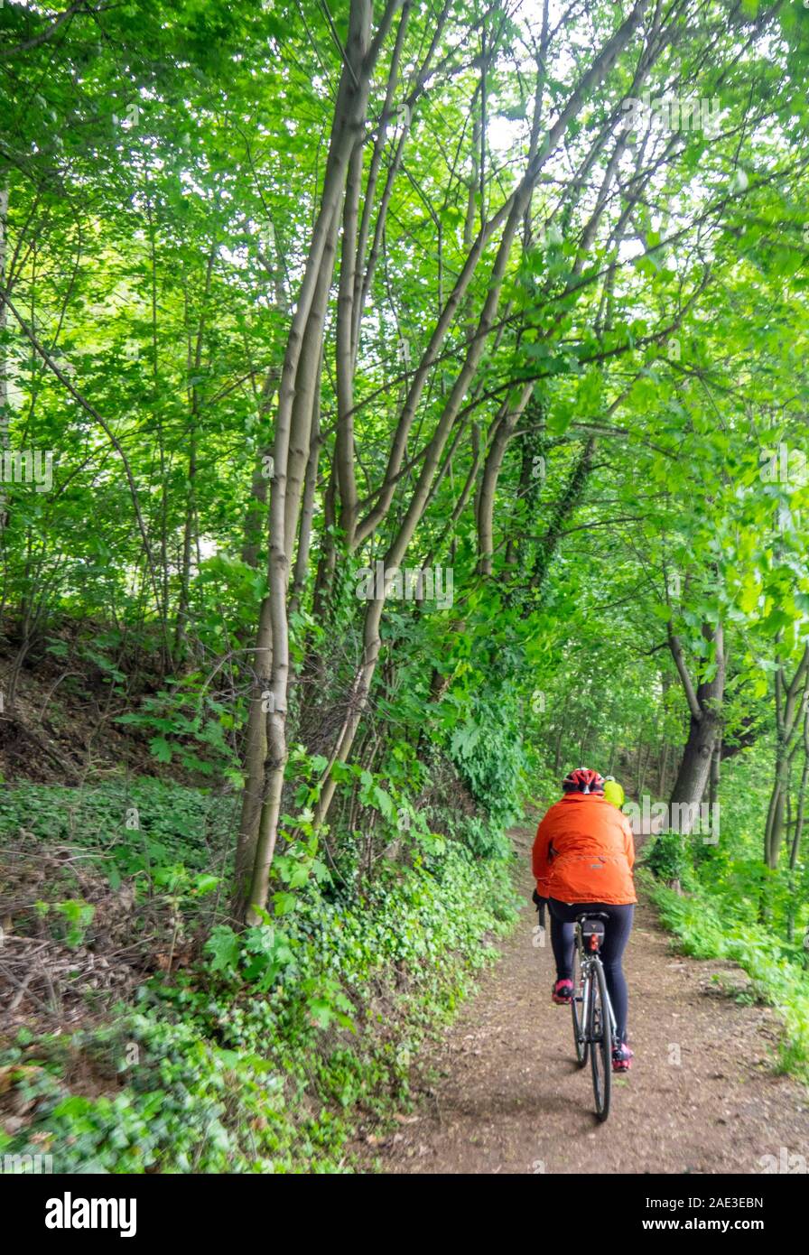 Woman traveler riding a bicycle on cycleway Vltava cycle route Eurovelo ...