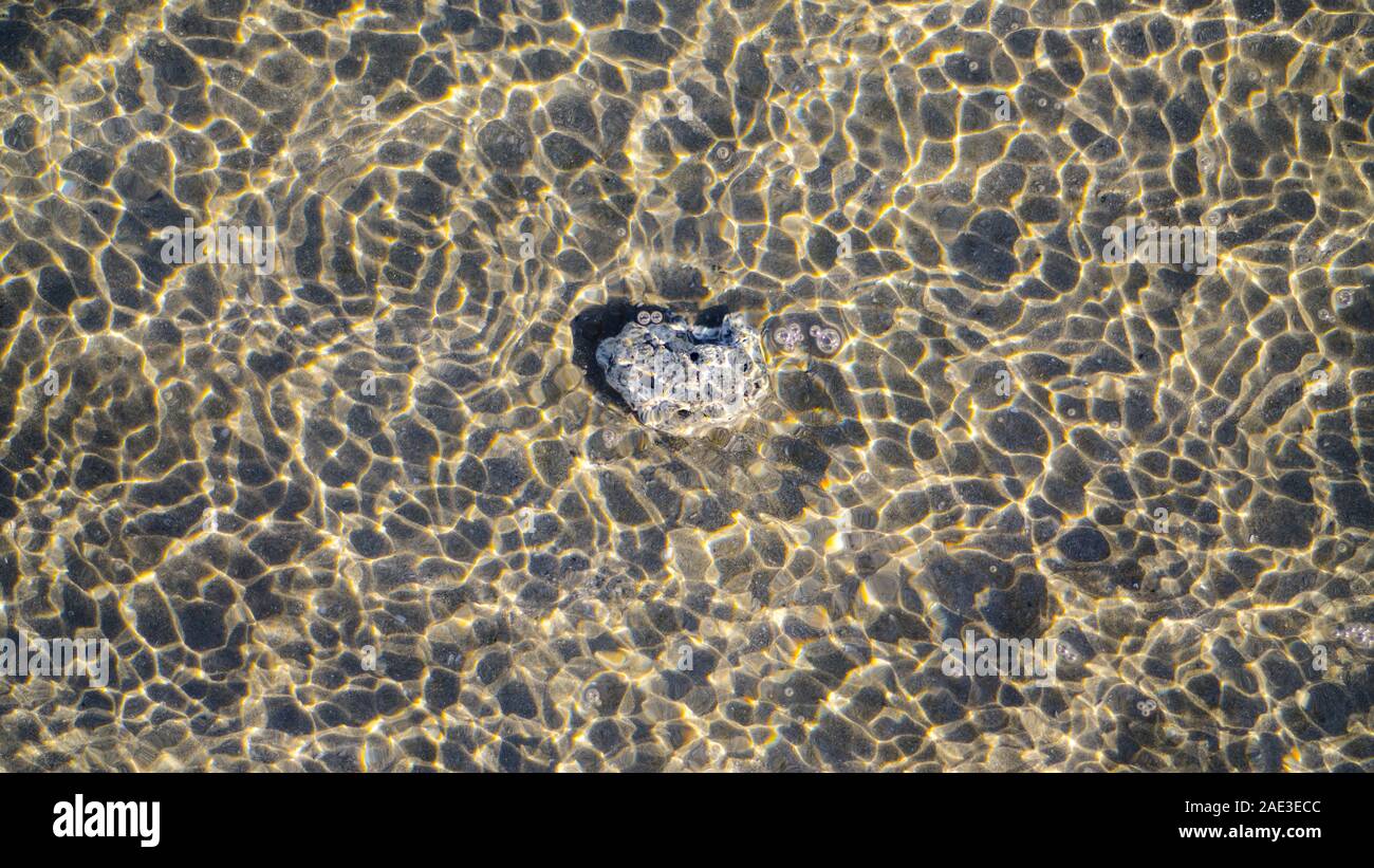 the stone in water Stock Photo - Alamy