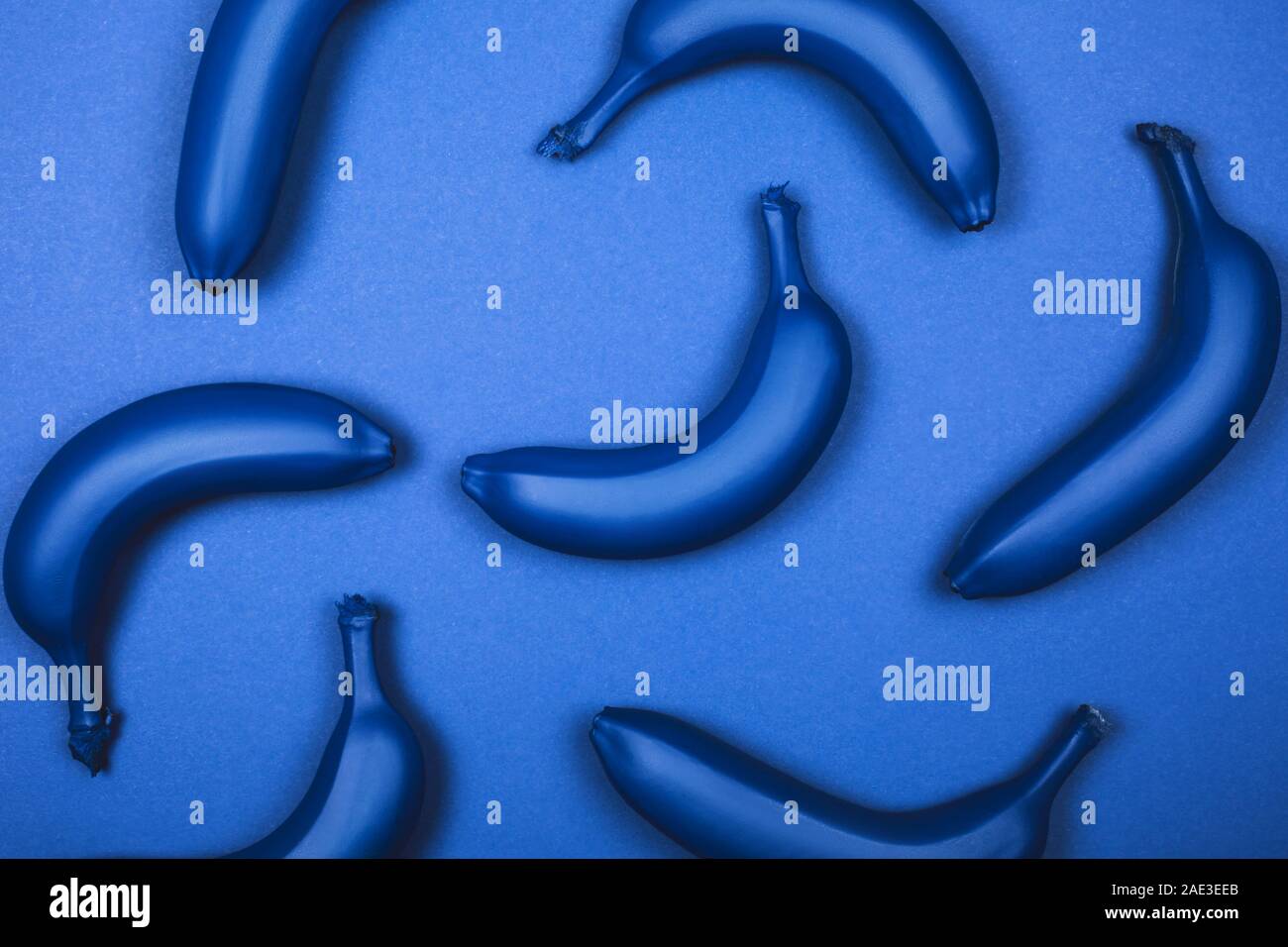 Blue bananas on blue. Flat lay style. Monochrome trendy photo ispired ...