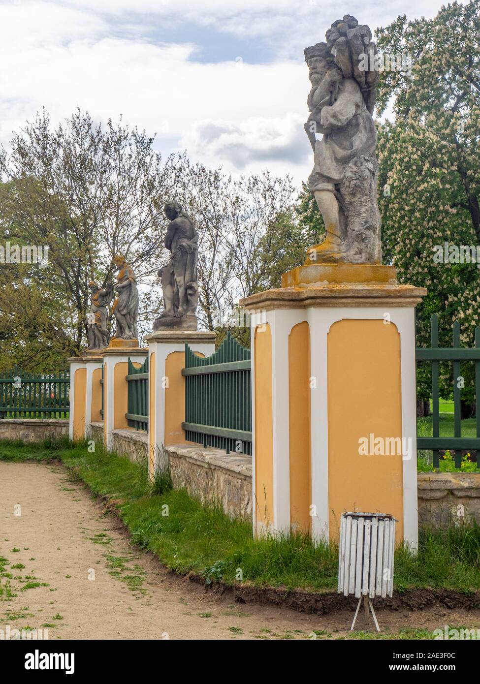 Stone statues on pillars along boundary fence of Veltrusy Mansion ...