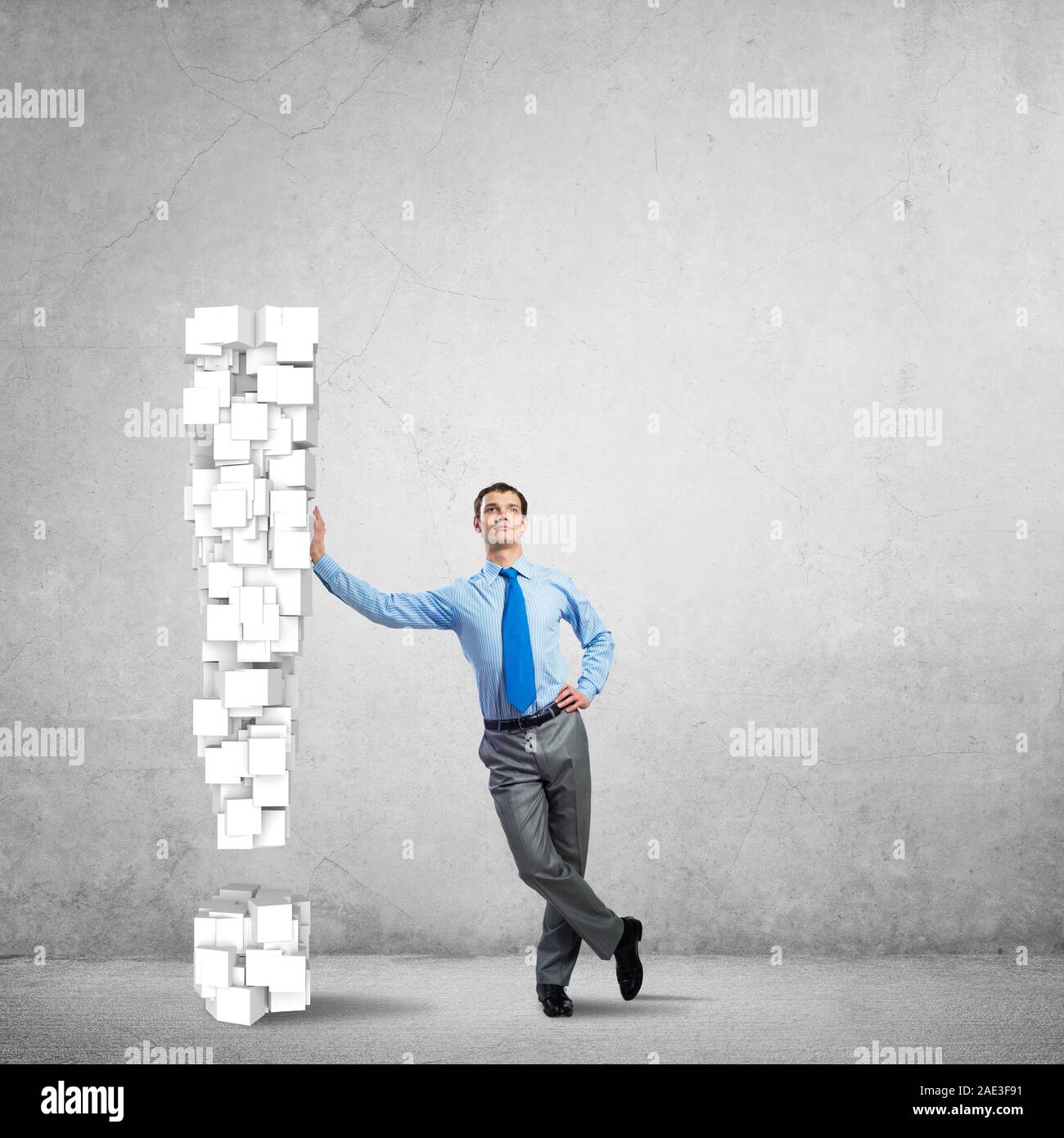 Man and big attention sign Stock Photo - Alamy