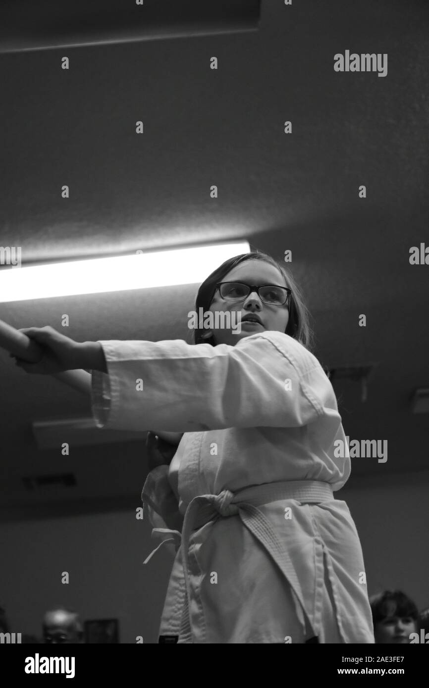 This action photo is of my daughter in her Karate class. Karate is a ...