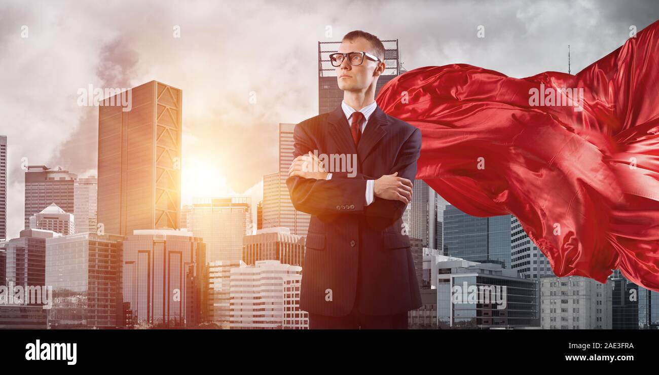 Concept of power and sucess with businessman superhero in big city ...