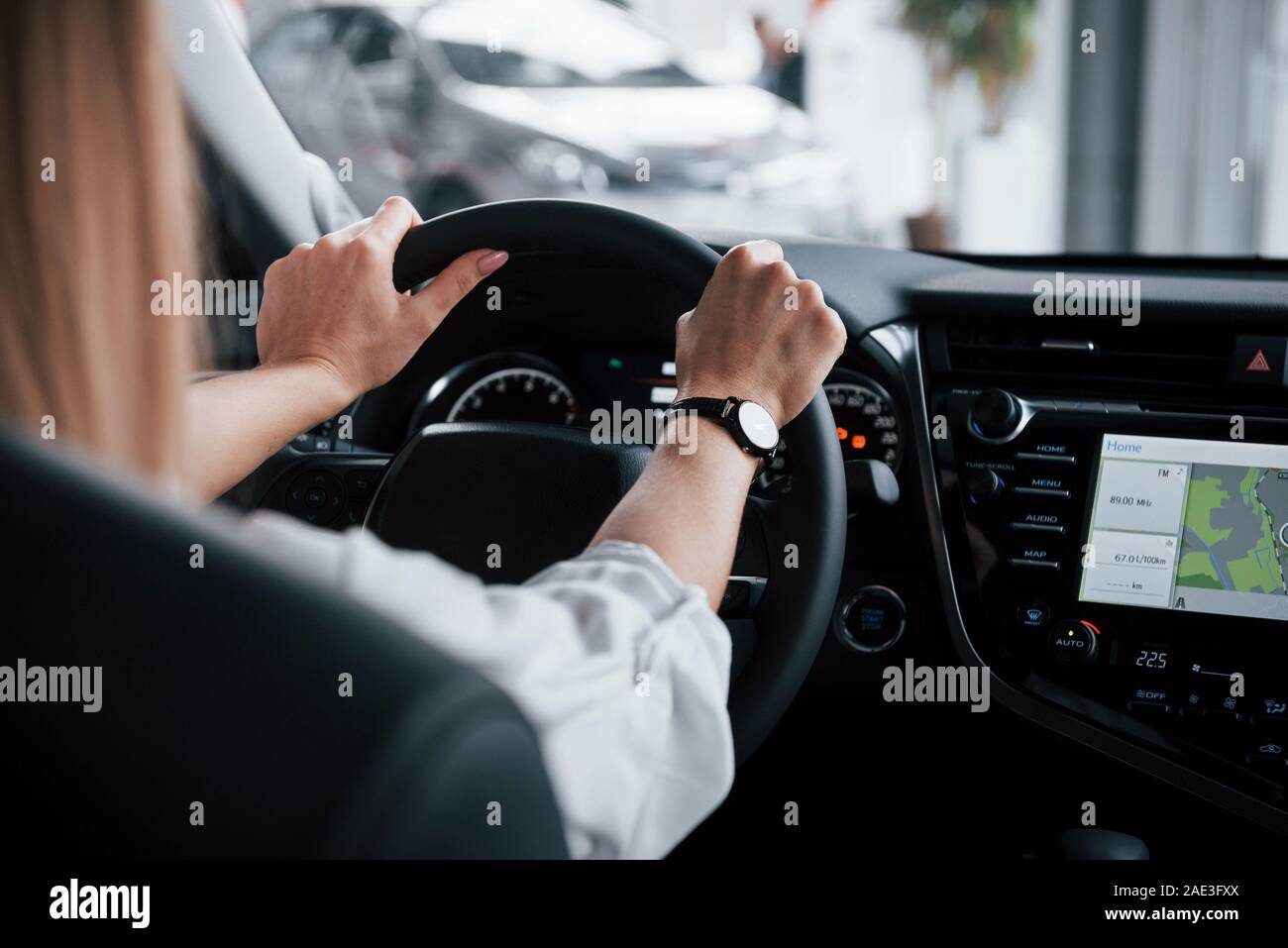 Need to test the navigation system. Close up view of woman's hands in ...