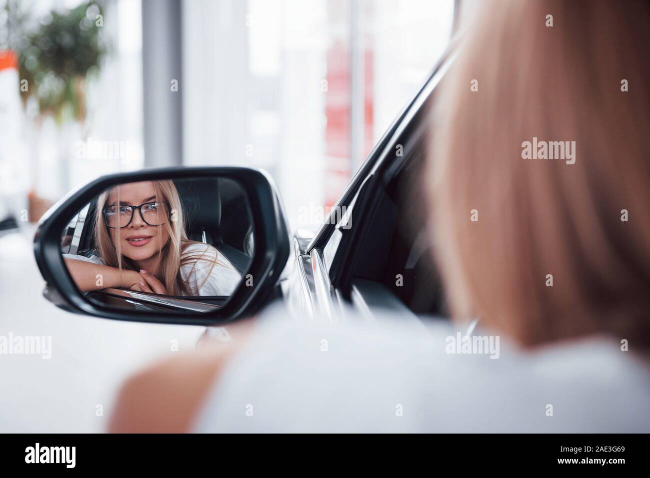 Looking at side mirror hi-res stock photography and images - Alamy