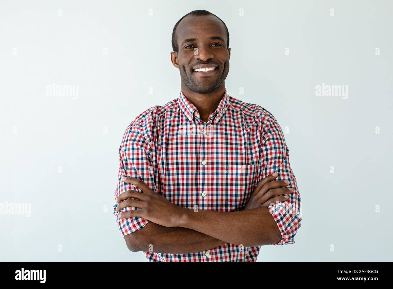 Joyful afro american man folding his hands Stock Photo - Alamy