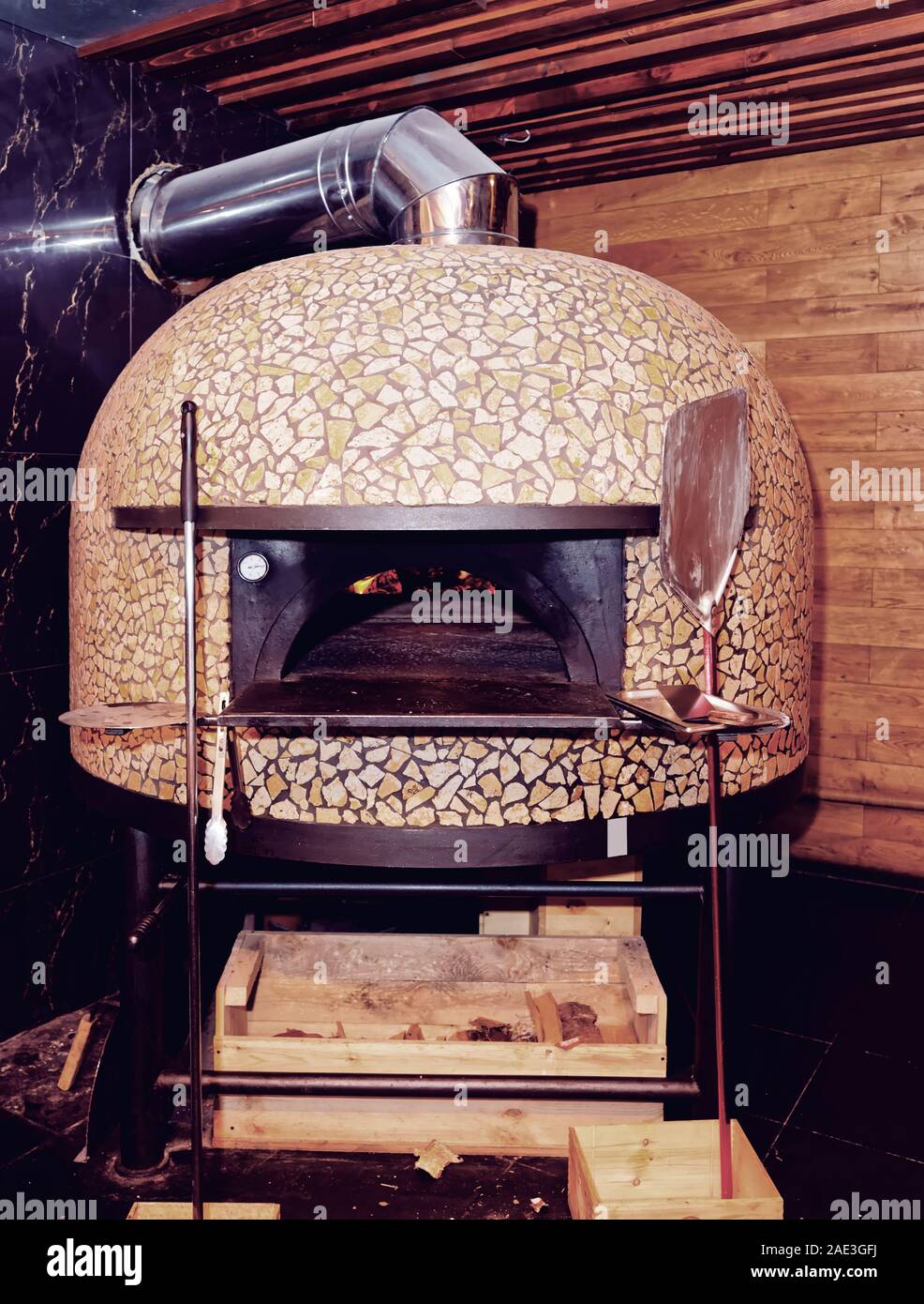 Traditional wood-fired italian pizza oven, toned photo Stock Photo - Alamy