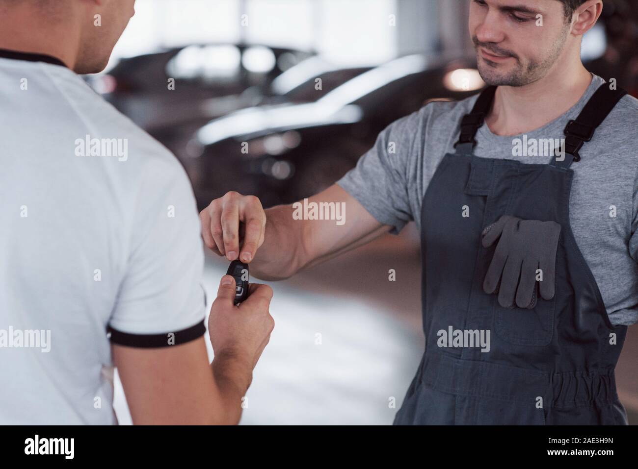 Car mechanic gives keys hi-res stock photography and images - Alamy